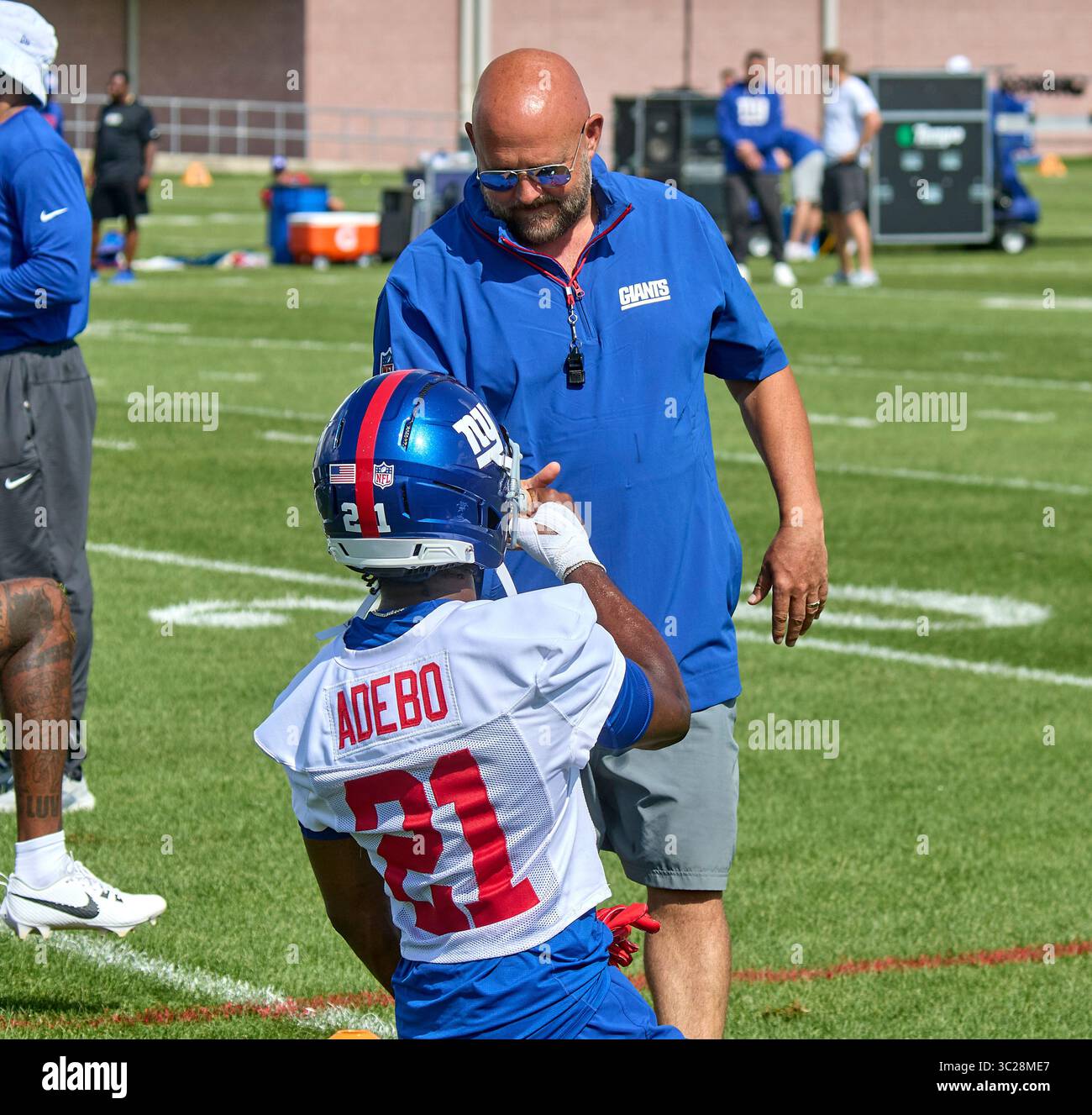 New York Giants head coach Brian Daboll with cornerback Paulson Adebo ...