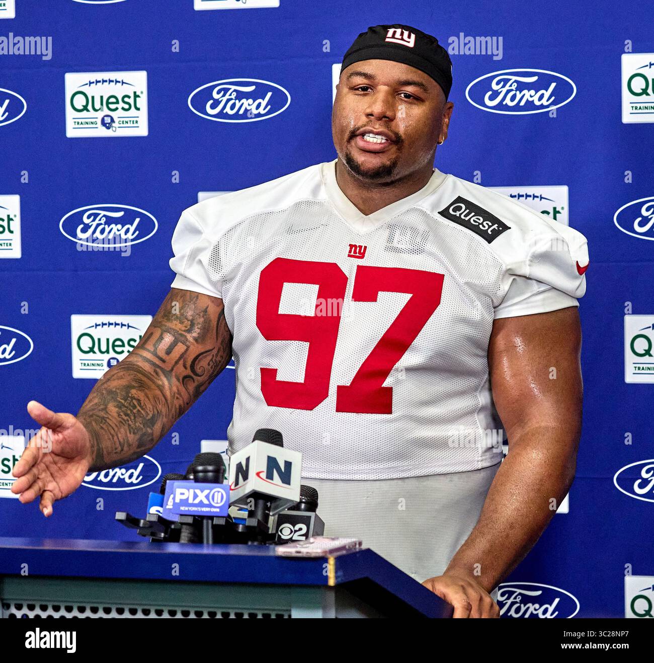 New York Giants defensive linemen Dexter Lawrence (97) talks with media ...