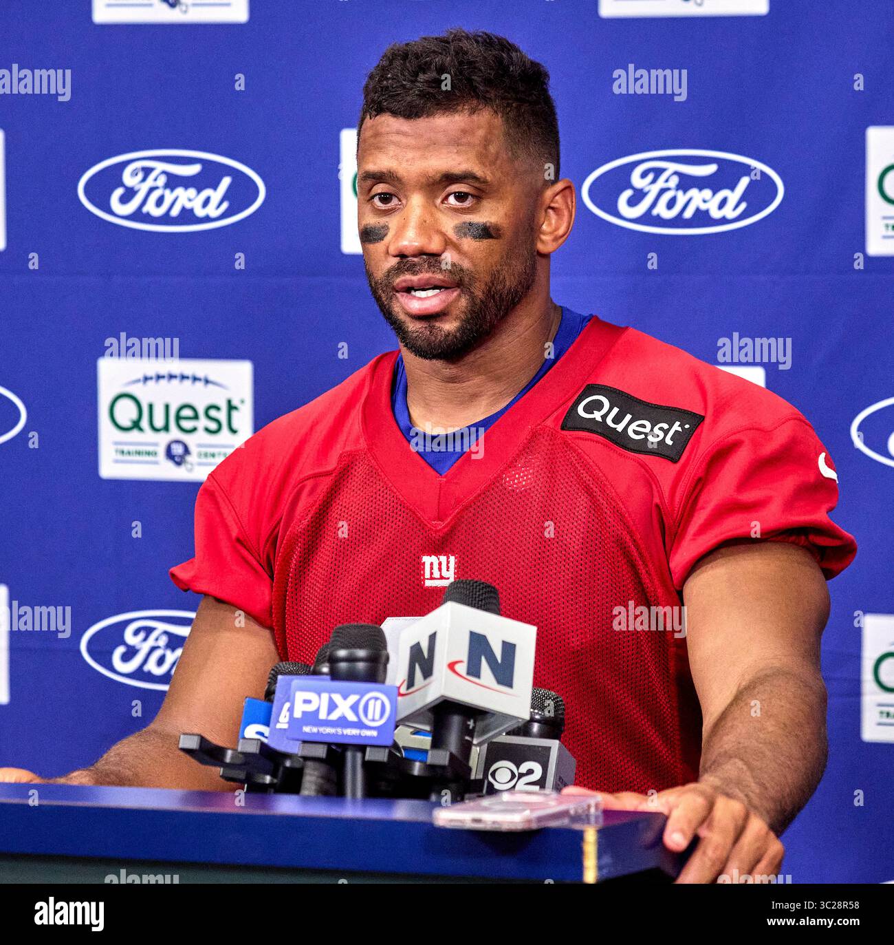 New York Giants quarterback Russell Wilson (3) talks with media during ...