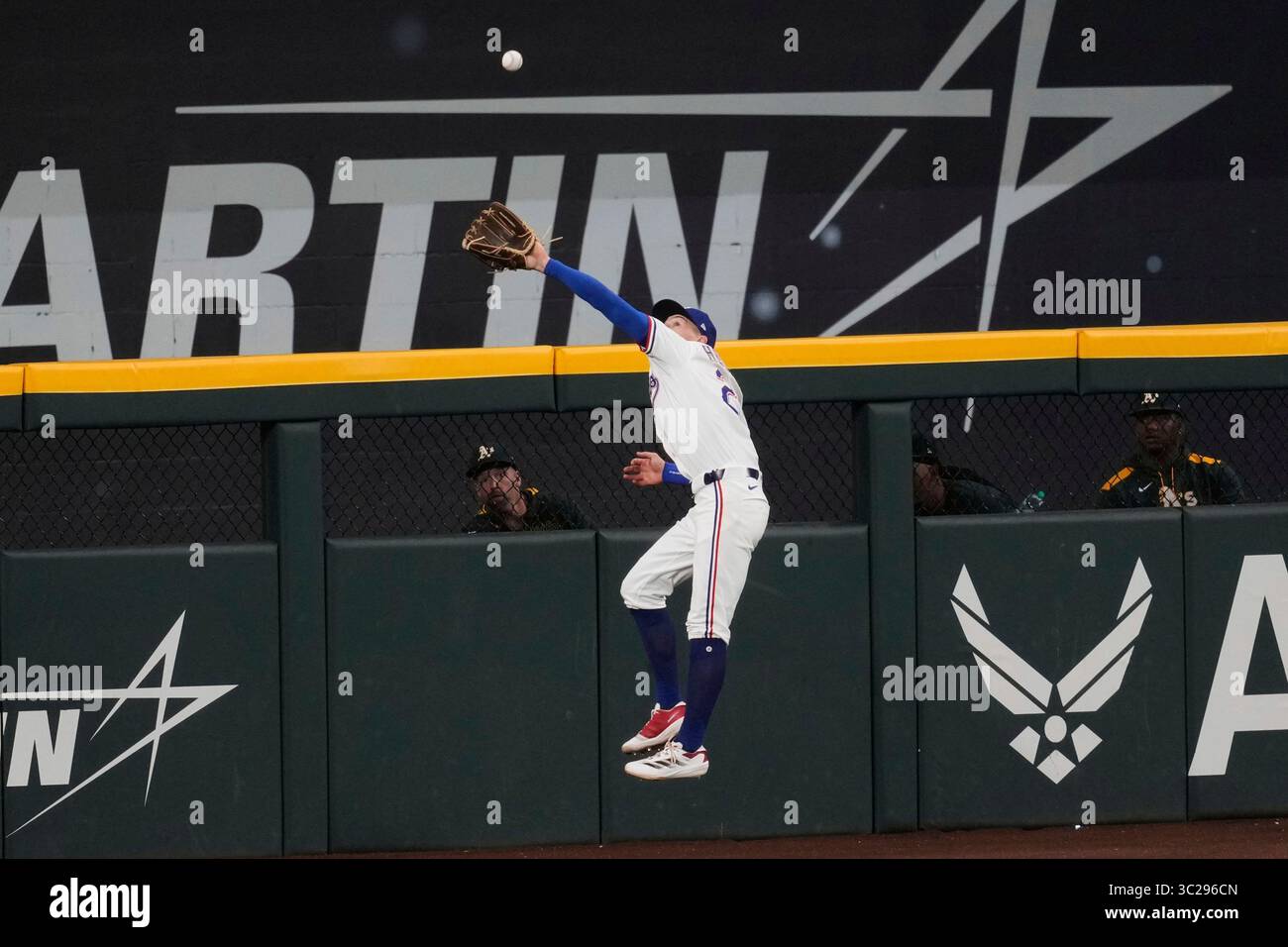 Texas Rangers center fielder Michael Helman makes a leaping catch on a ...