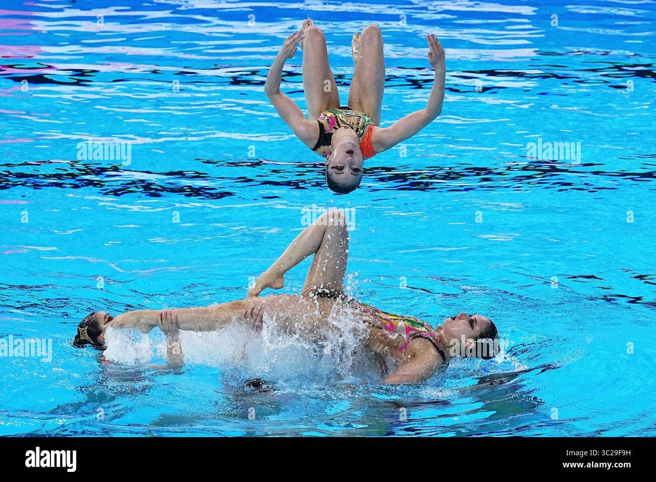 compete in the team acrobatic preliminary of artistic swimming at the ...