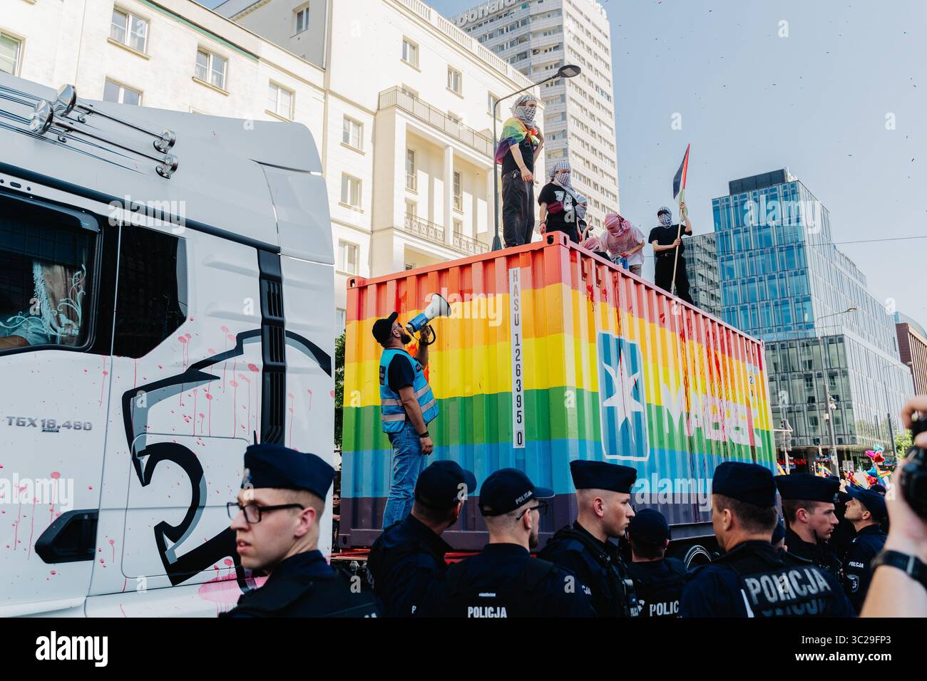Protesters on top of the Maersk vehicle chant anti-genocide slogans ...