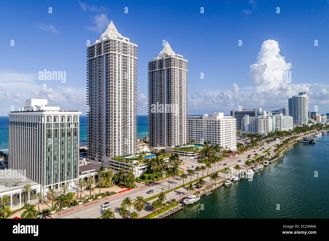 Luxury twin towers with diamond shaped rooftop crowns facing the ocean ...