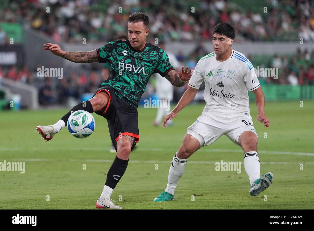 Liga MX All-Stars' Gustavo Ferraris, left, moves the ball past MLS All ...
