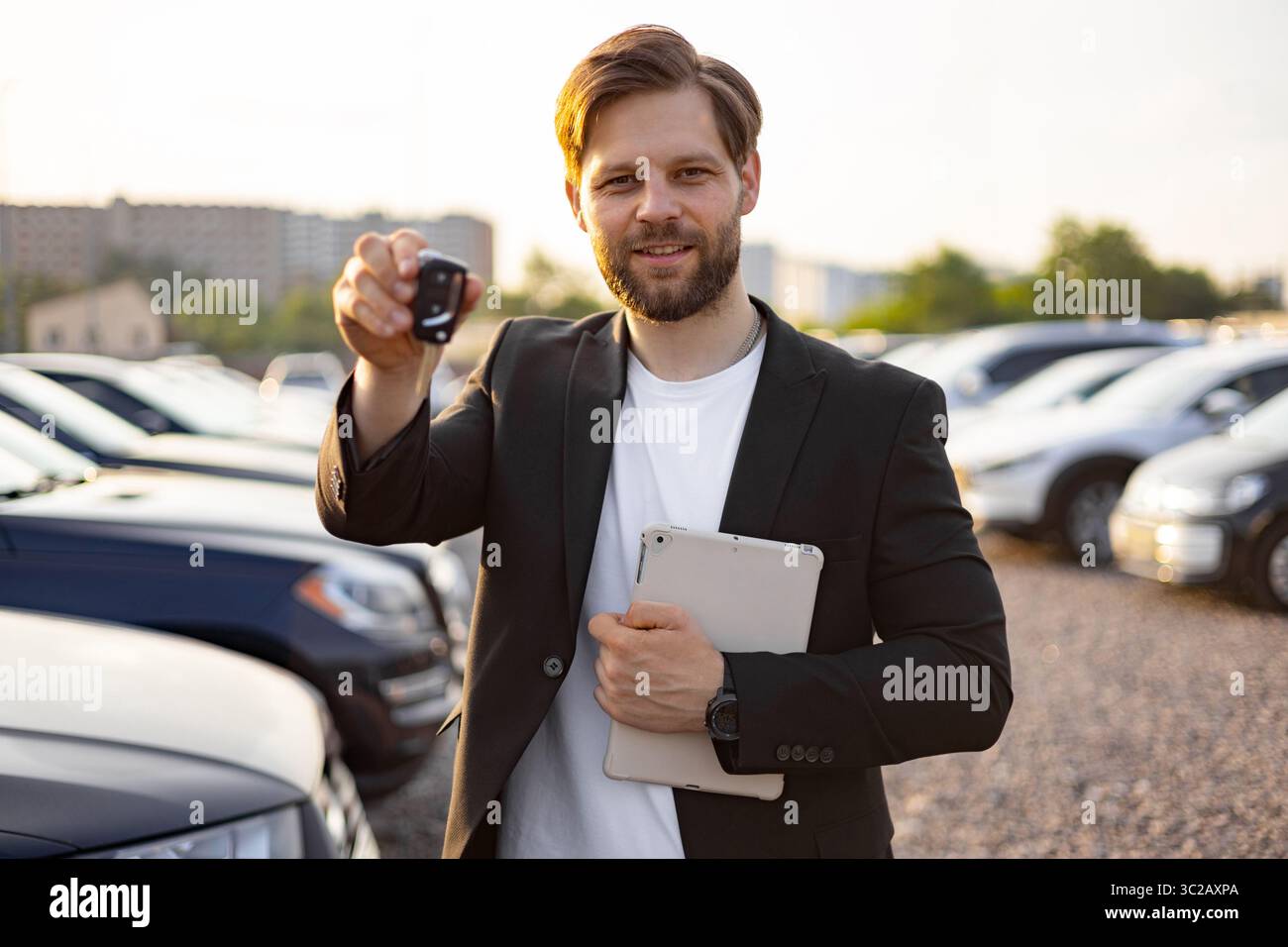 Car Salesman with Car Key Stock Photo - Alamy