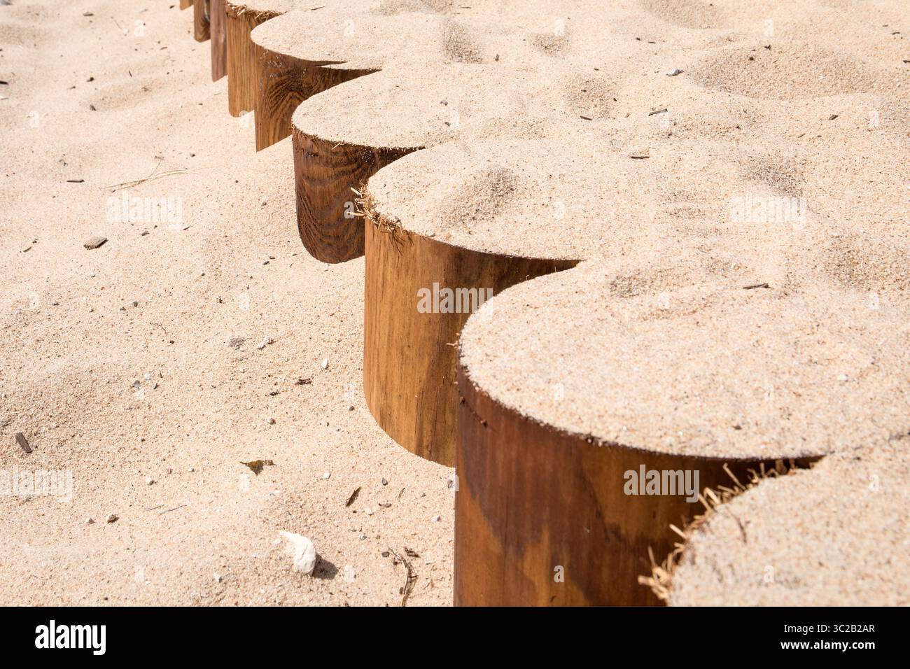 Wooden Border Partially Covered with Sand on a Sunny Beach Stock Photo ...