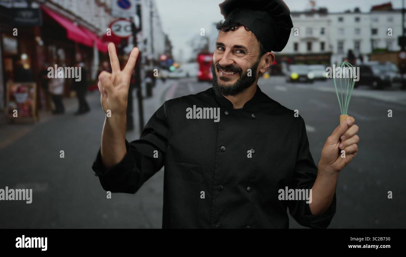 Hispanic man chef smiling in outdoor street setting holding whisk ...