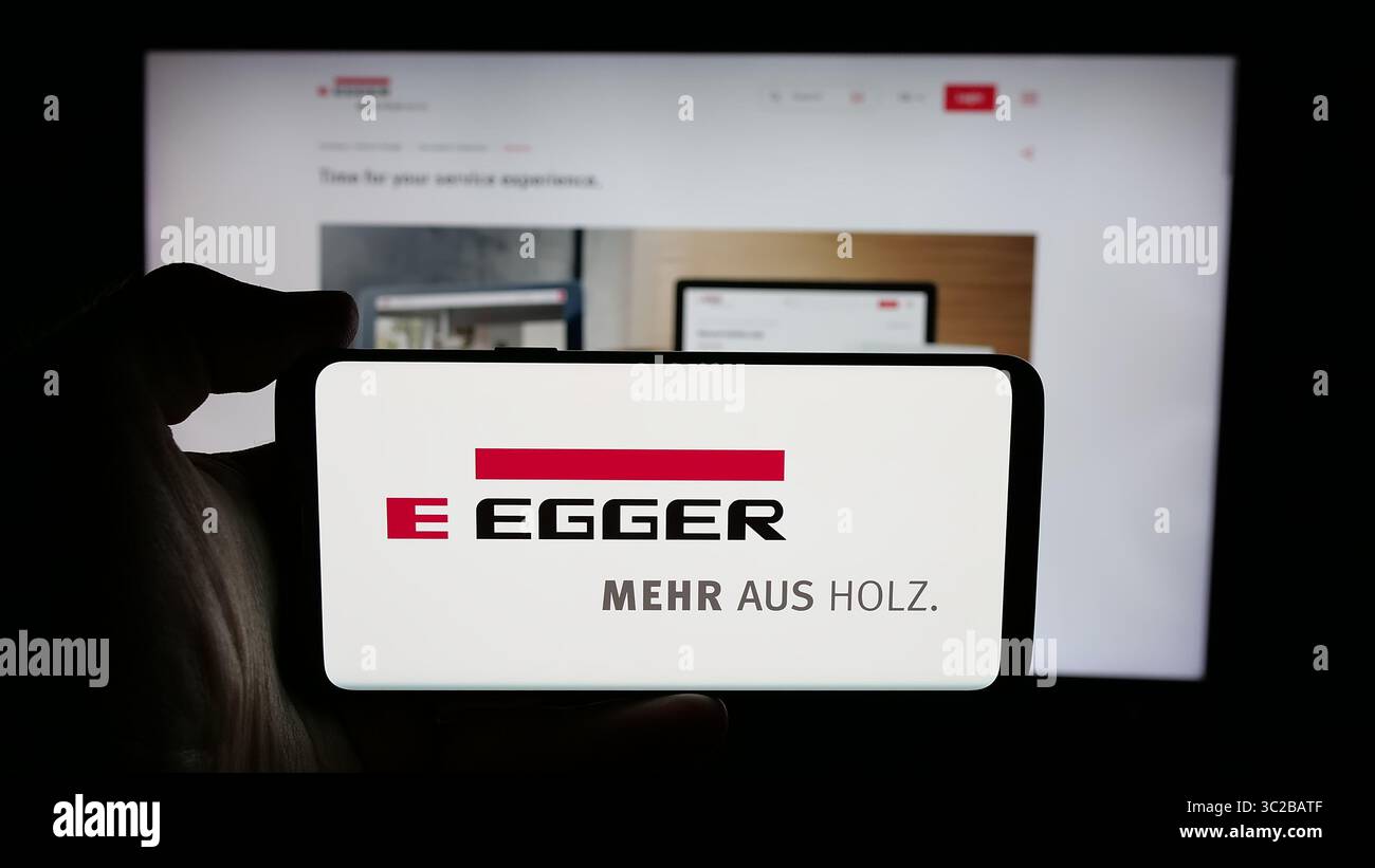 Stuttgart, Germany - 05-31-2025: Person holding cellphone with logo of ...