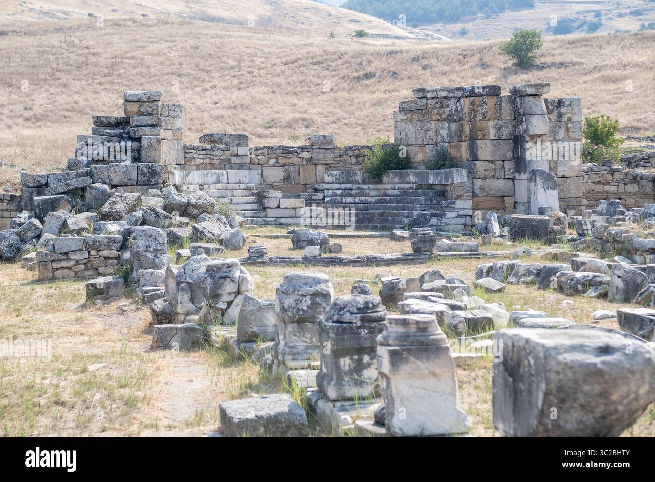Ancient stone structures stand in Pamukkale, showcasing the remnants of ...