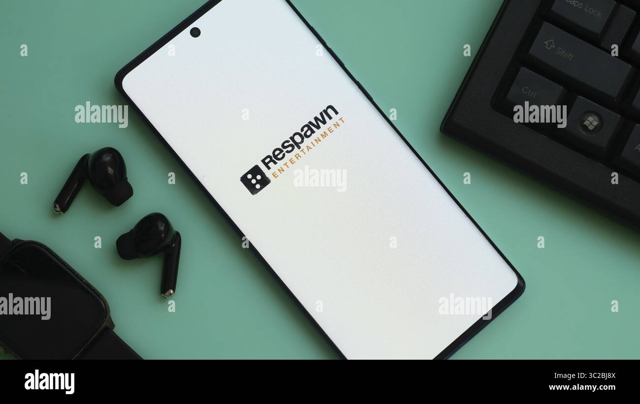 Respawn Entertainment logo on a smartphone with earbuds on a minimalist ...
