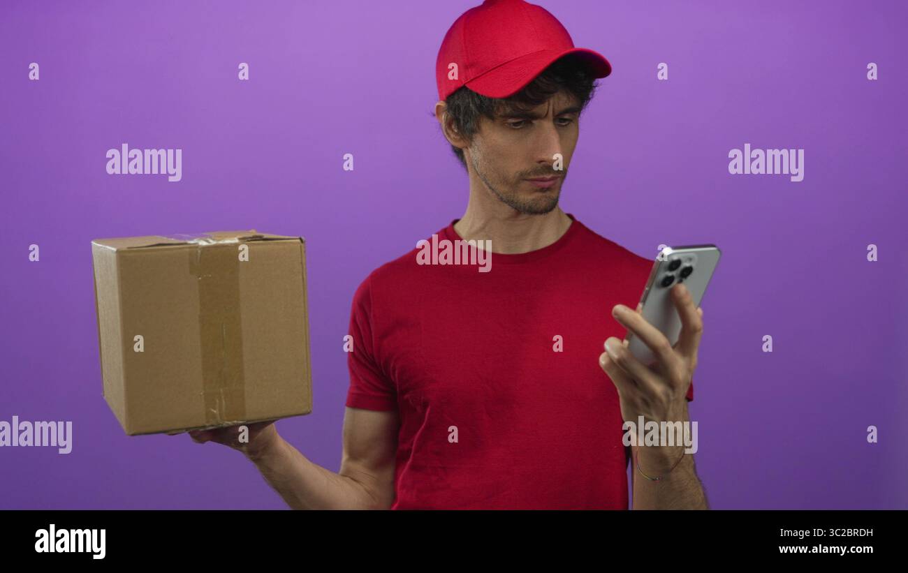 Delivery man holds package scrolls hi-res stock photography and images ...