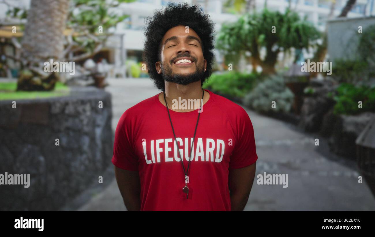 Man lifeguard in red shirt hi-res stock photography and images - Alamy