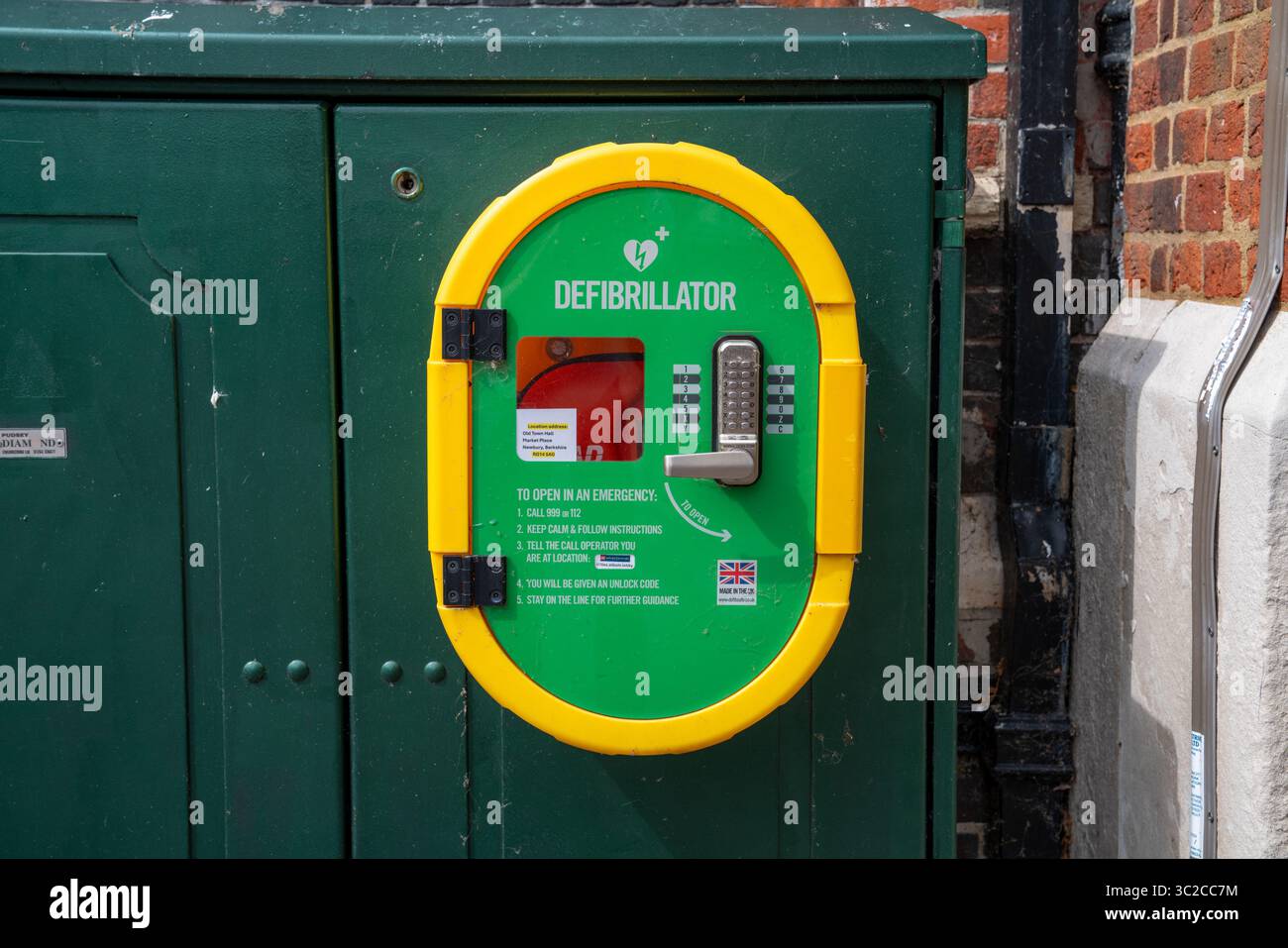 July 2025 View of a defibrillator medical equipment fixed to a cabinet ...