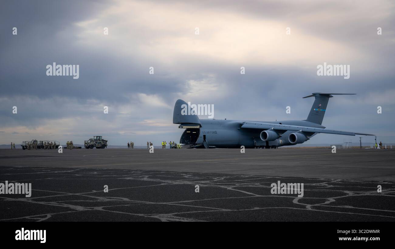 Airmen with the 521st Contingency Response Squadron unload a C-5M Super ...