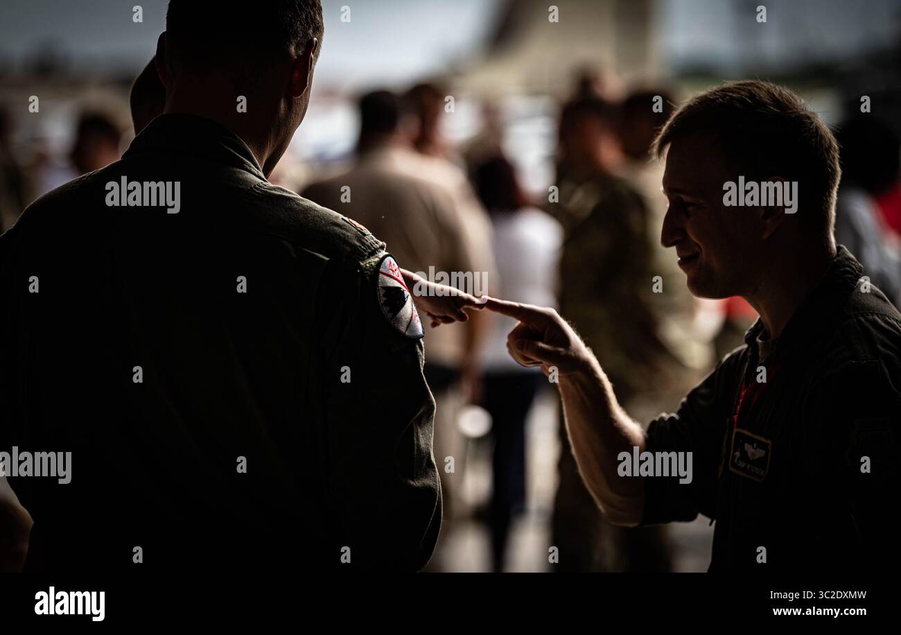 Families embrace their loved ones during a redeployment event at ...