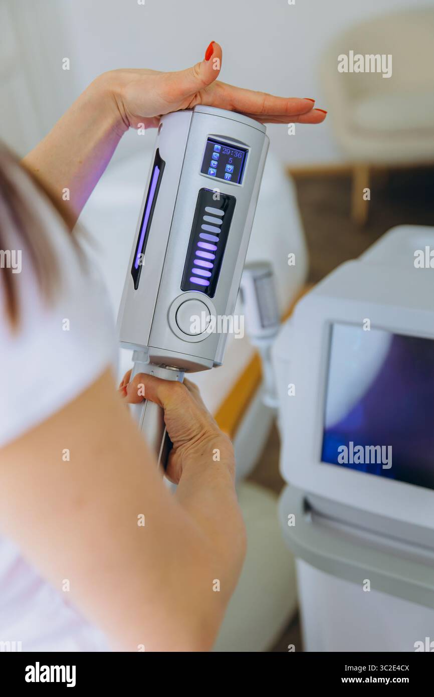 Cosmetologist adjusting endosphere therapy machine before anti ...