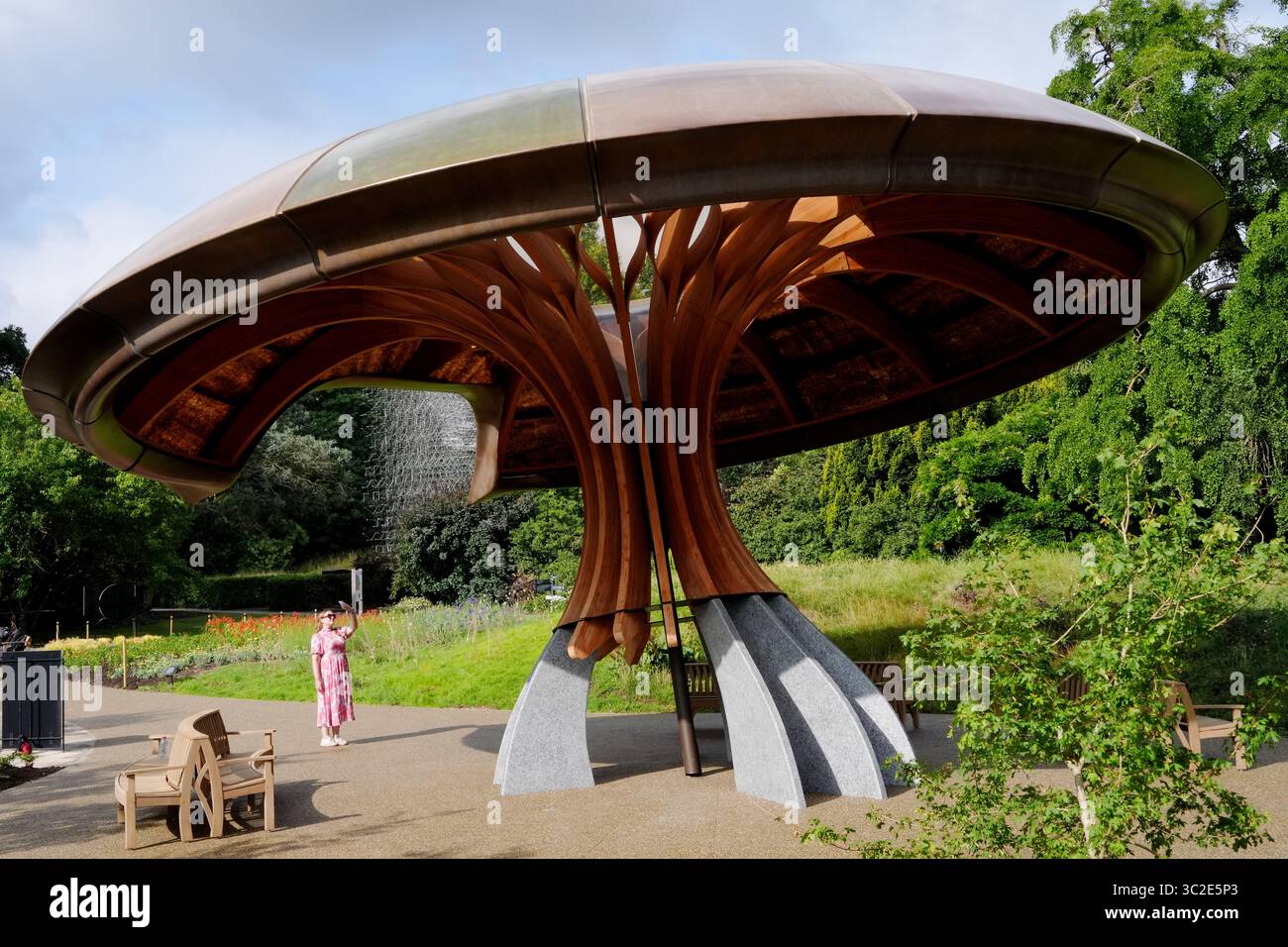 A member of Kew staff photographs a fungi-inspired pavilion created ...