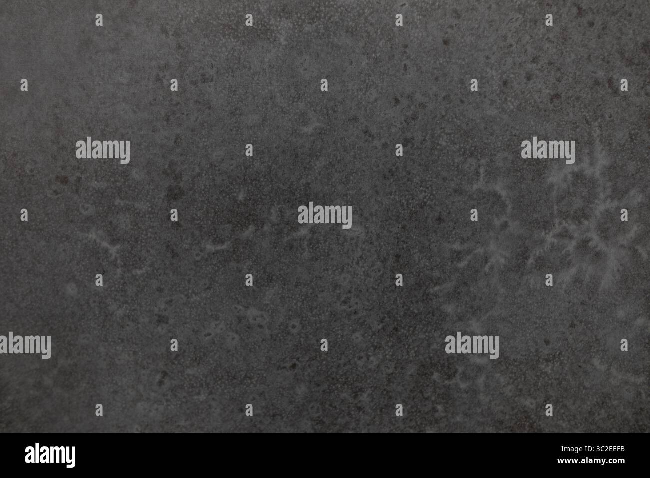 Dark textured surface with subtle patterns highlighting natural ...