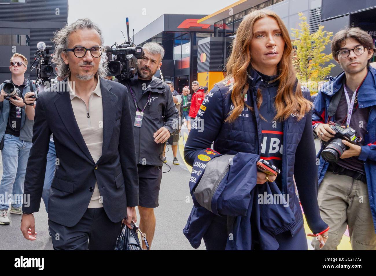 Red Bull team principal Laurent Mekies, left, arrives in the paddock ...