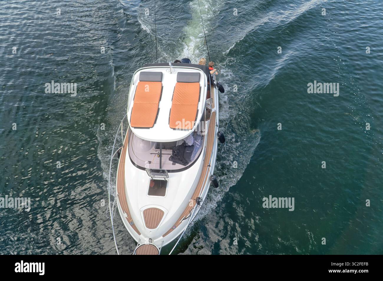 Aerial view of modern fishing boat with family of anglers on the deck ...