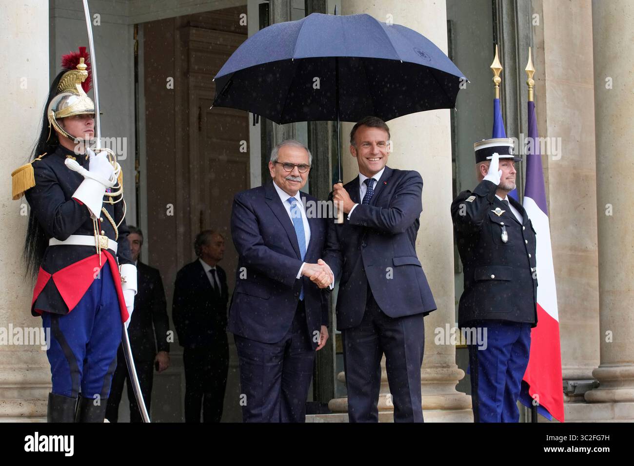 French President Emmanuel Macron, right, welcomes Lebanese Prime ...