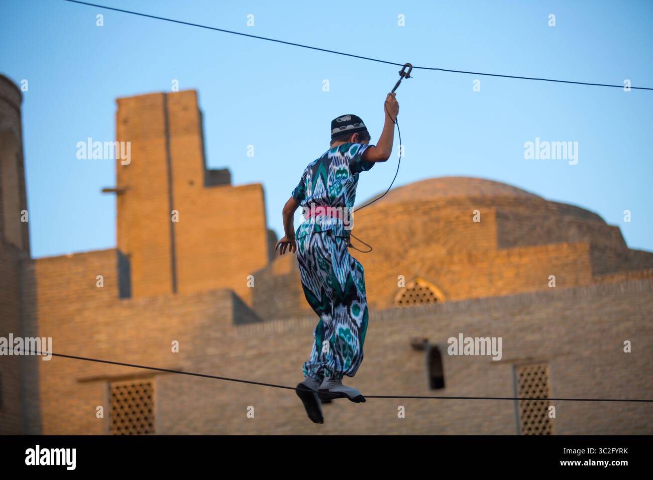 Tightrope Walker Kid shows walk on the tightrope Stock Photo - Alamy