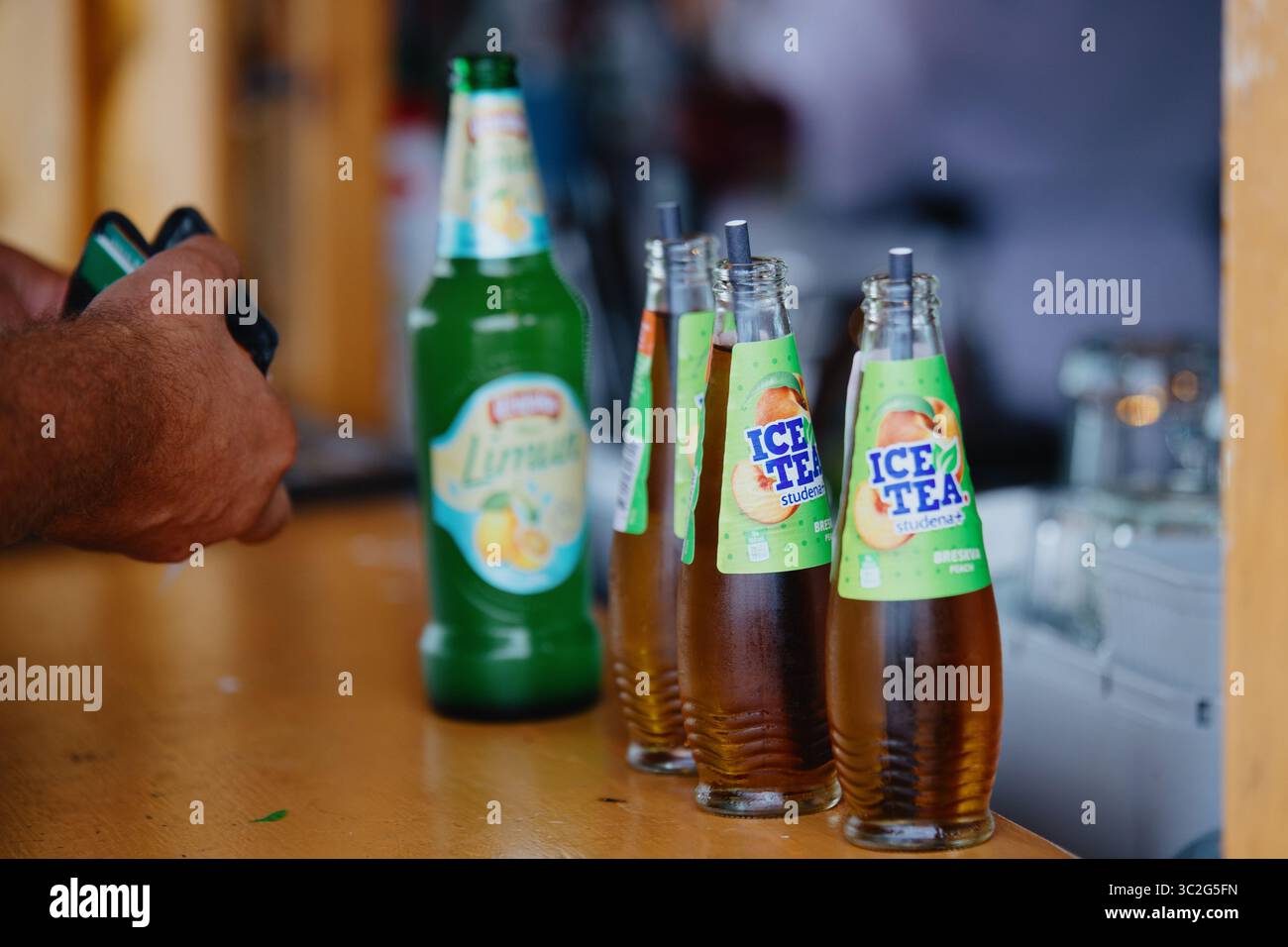 Lemon beer and iced tea in bottles on the bar counter. Beach bar ...