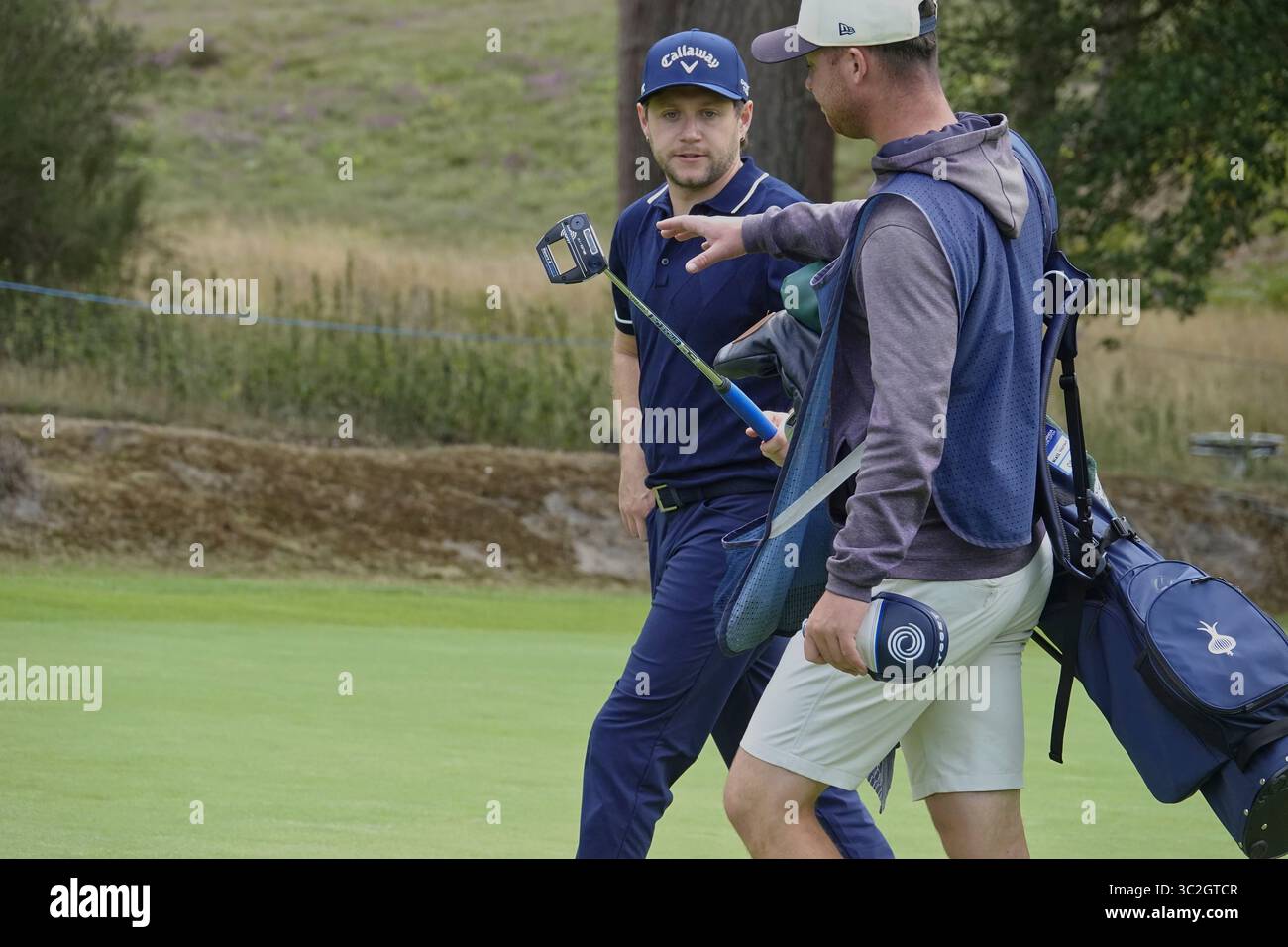22nd July, 2025 Sunningdale, Berkshire, UK Niall Horan, with his caddy ...