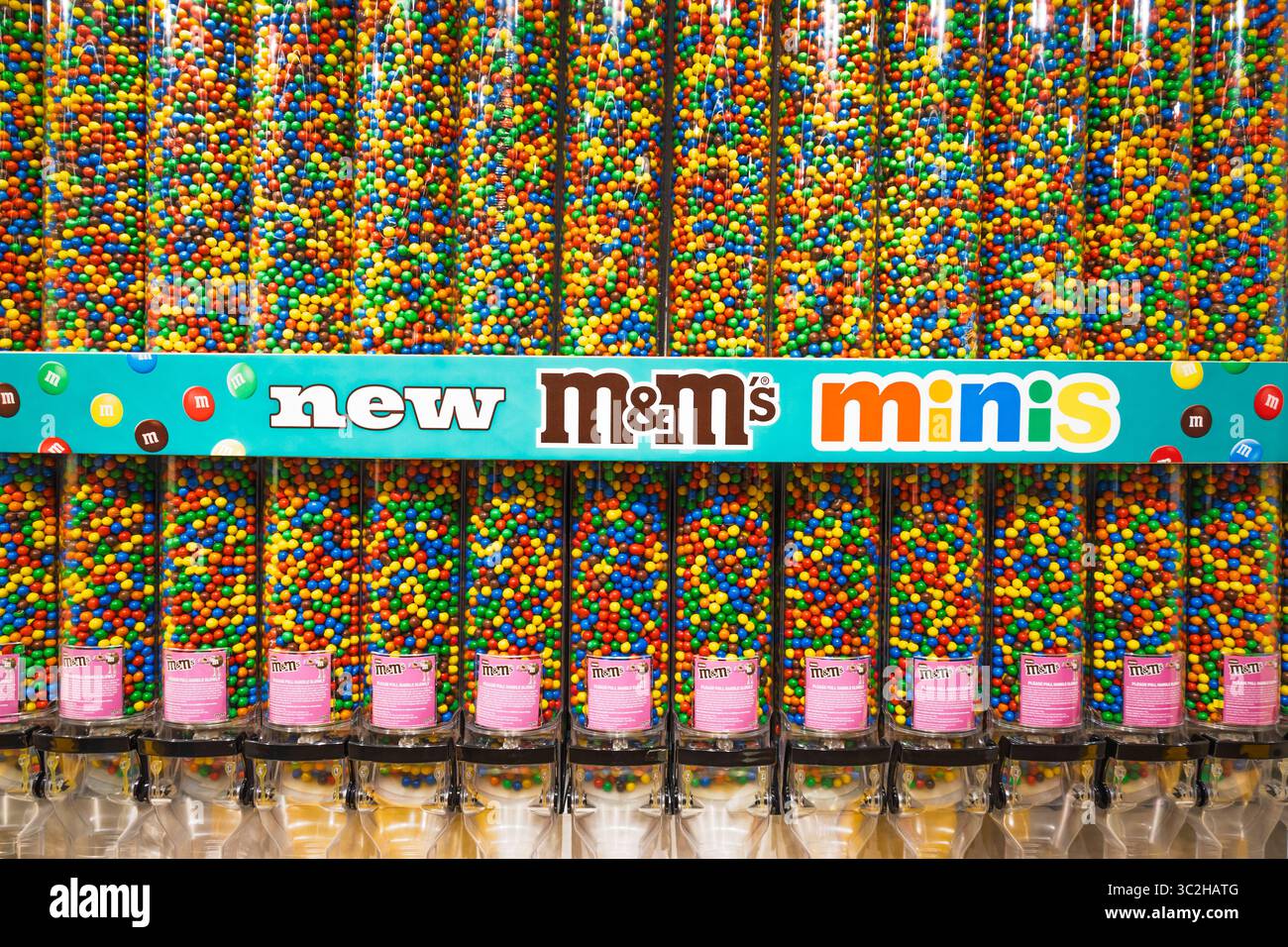 Wall of Multicolored M and M Minis Candy Dispensers at Flagship Store ...