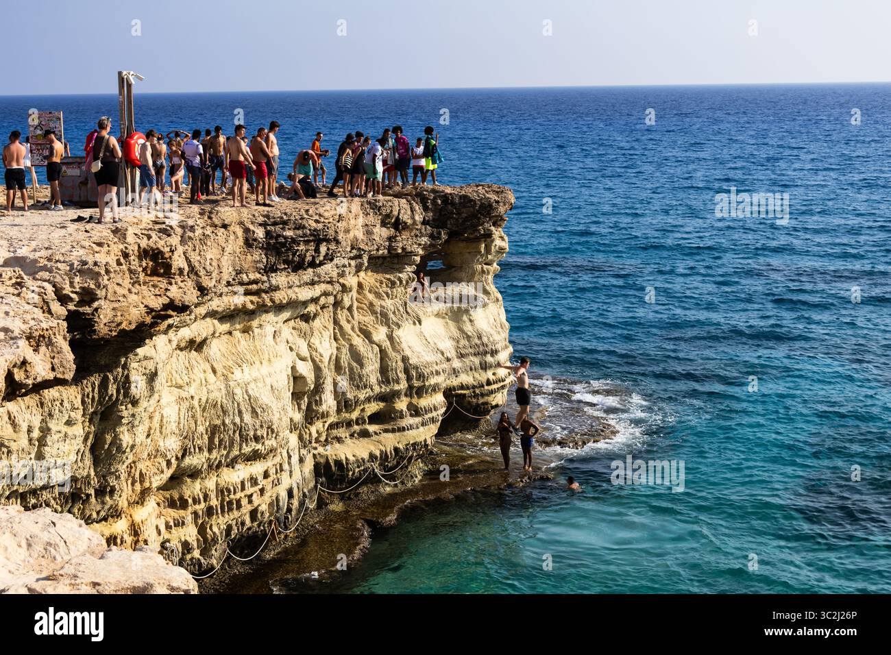 Agia Napa , Cyprus, 07-10-2025. Tourists jumping from the cliff at Cavo ...