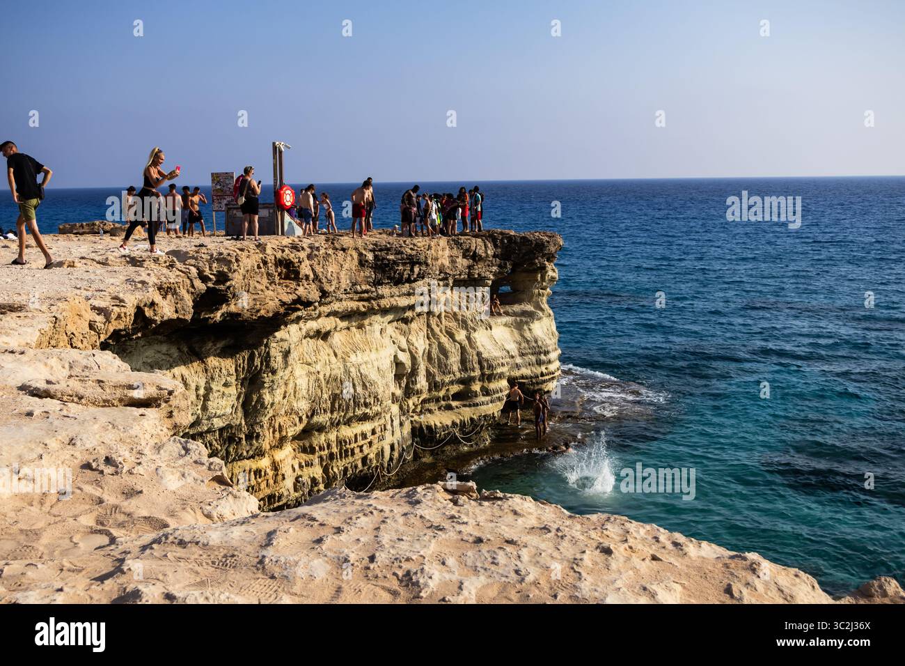 Agia Napa , Cyprus, 07-10-2025. Tourists jumping from the cliff at Cavo ...