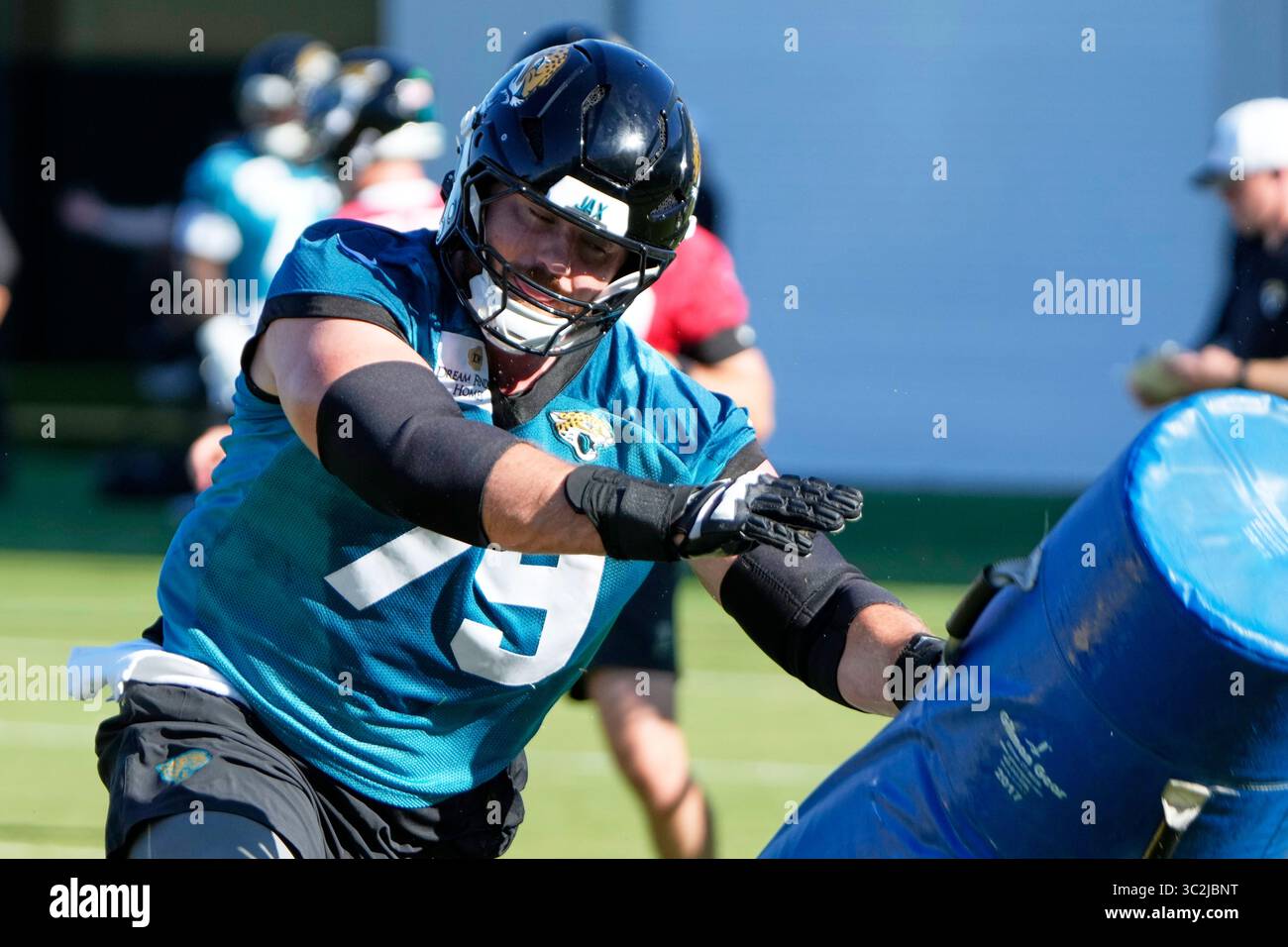 Jacksonville Jaguars center Luke Fortner performs a drill during ...