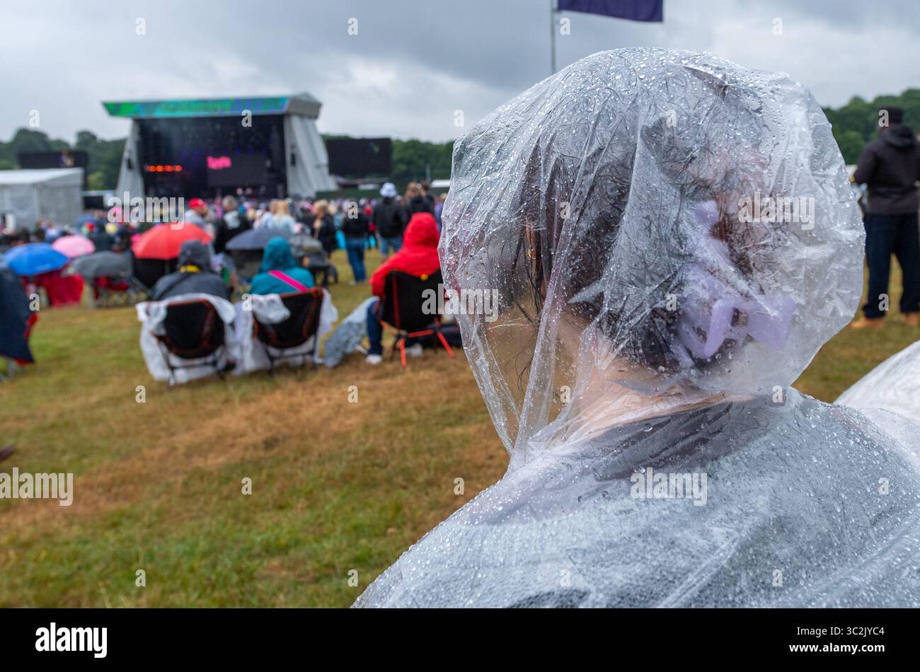 Festival fans, regardless of the rain, enjoying the music at the ...