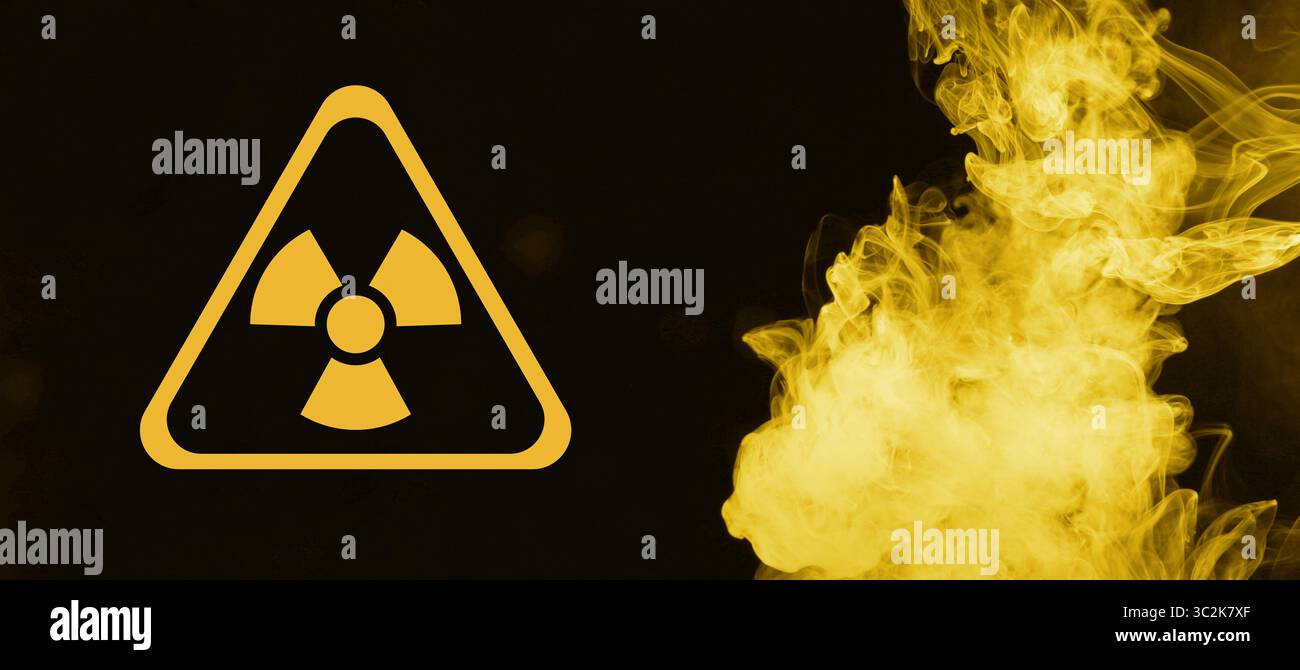 Radioactive sign and yellow toxic smoke against black background ...