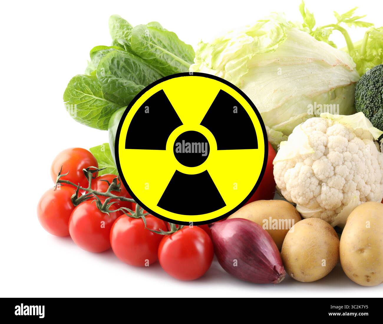 Fresh vegetables and radioactive sign on white background ...