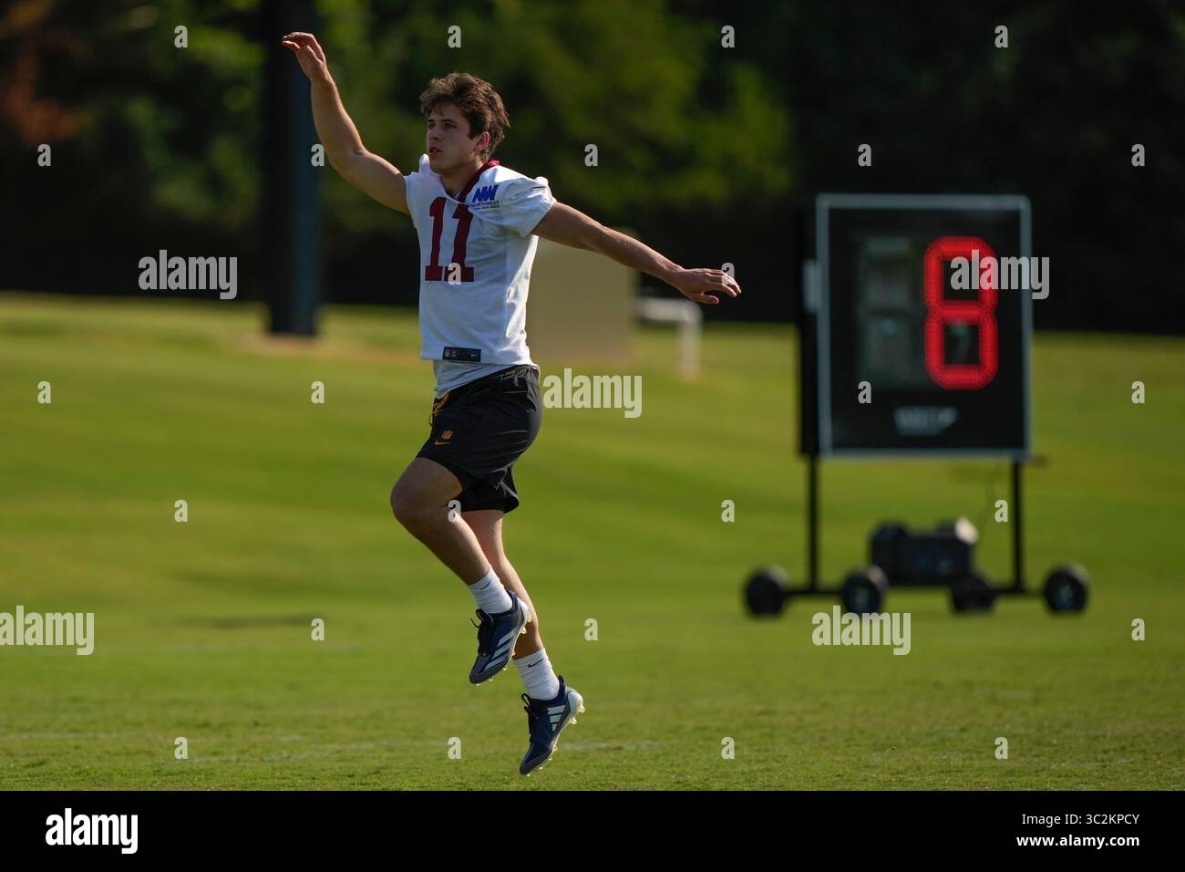 Washington Commanders wide receiver Luke McCaffrey (11) warms up during ...