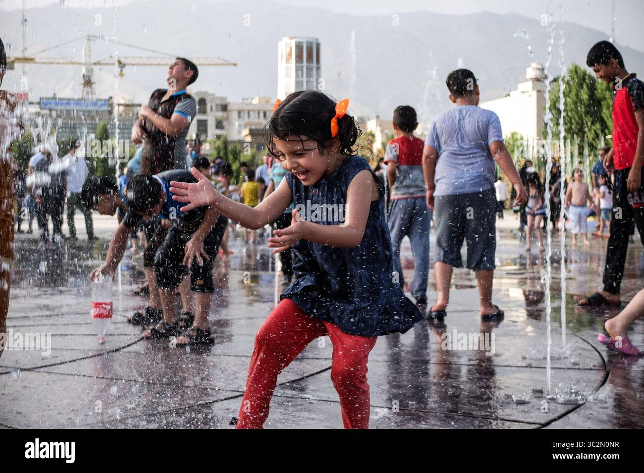 July 7, 2017 - Tehran, Tehran, IRAN - Children cool off in a fountain ...