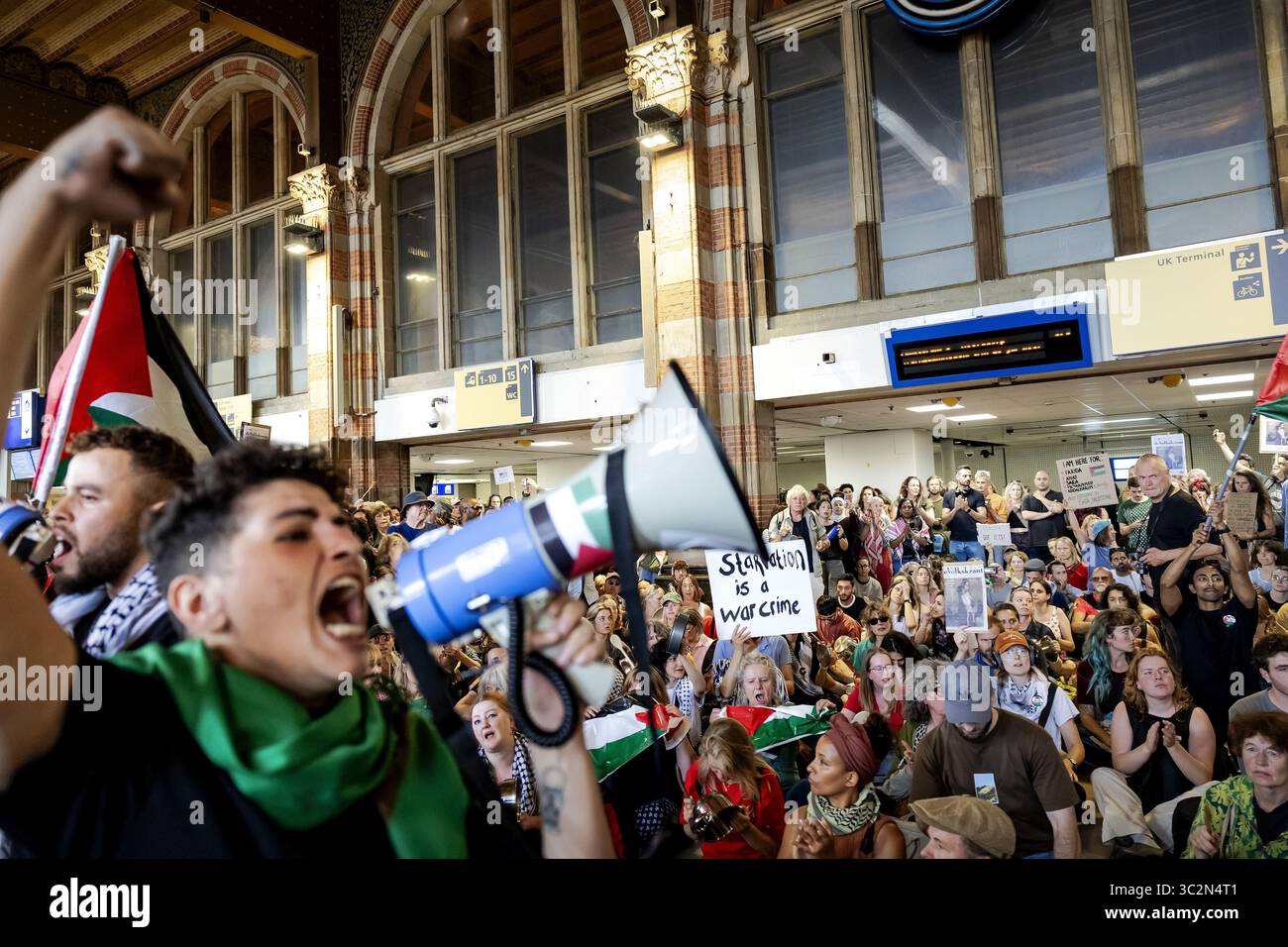 AMSTERDAM - Participants during a demonstration at Amsterdam Central ...