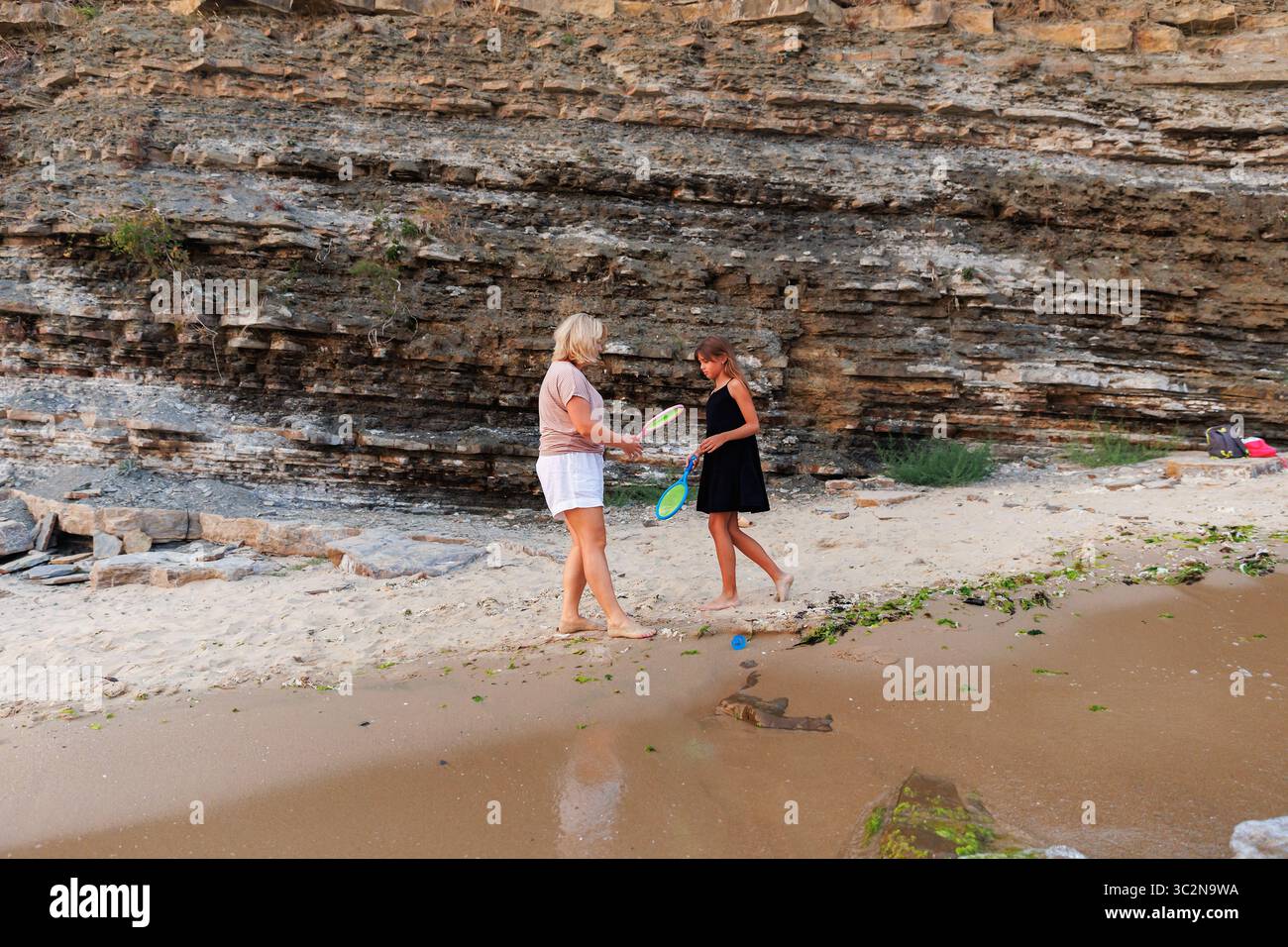 Mother and Daughter Pausing Game Together Stock Photo - Alamy