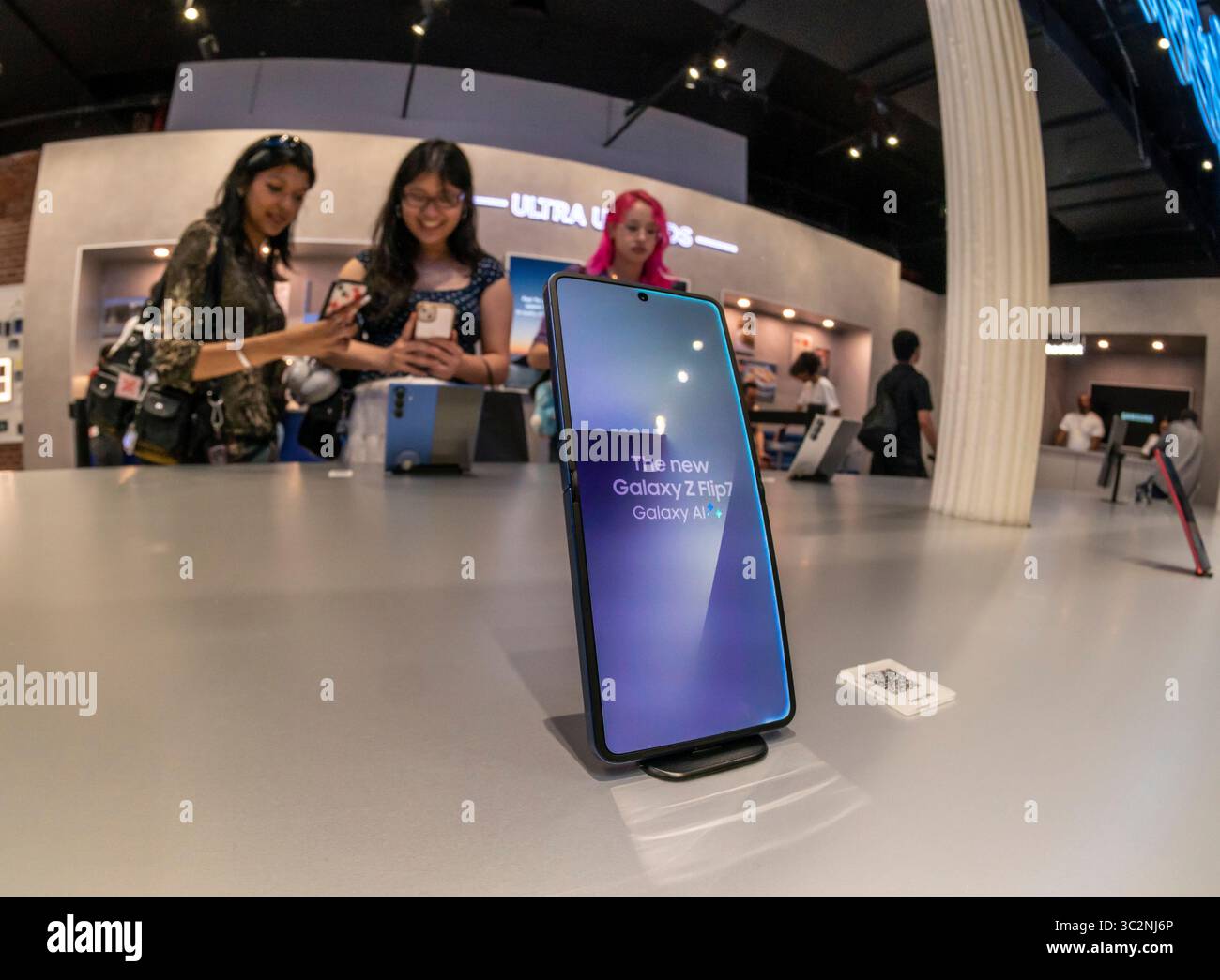 Visitors to the Samsung Galaxy pop-up event in Soho in New York admire ...