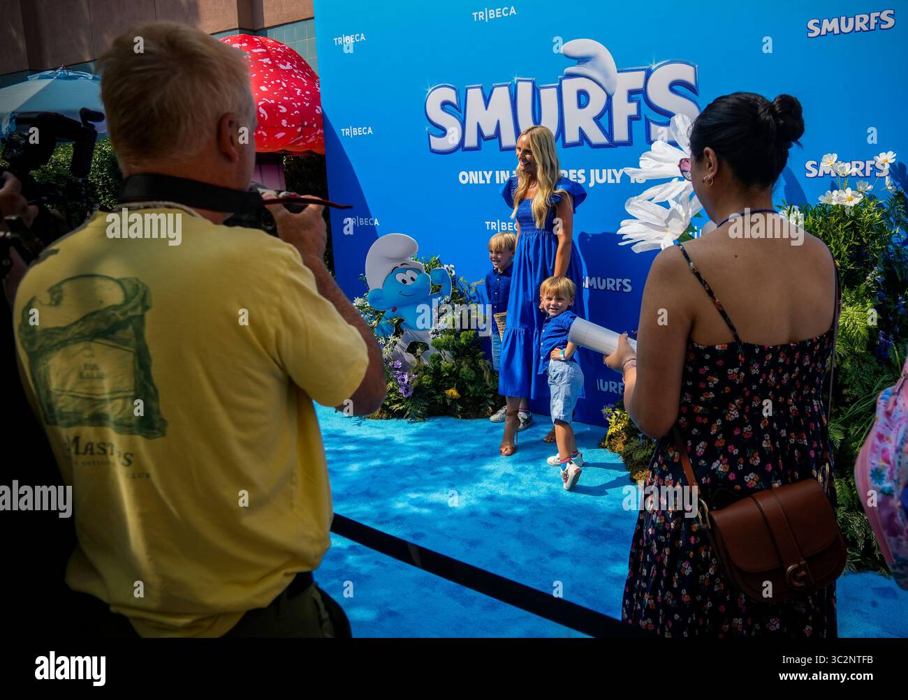 Influencer/model Jackie Miranne poses on the “blue carpet” outside the ...