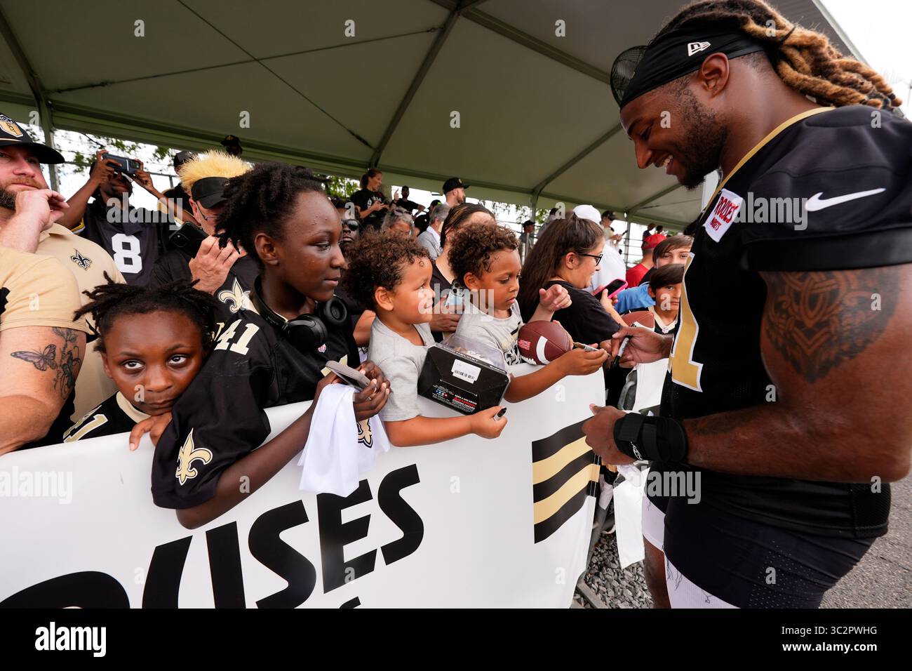 New Orleans Saints safety Justin Reid signs autographs during an NFL ...