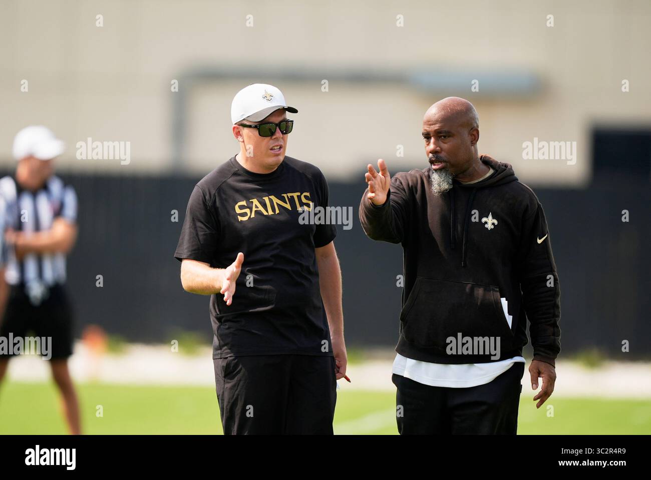 New Orleans Saints head coach Kellen Moore talks with wide receivers ...