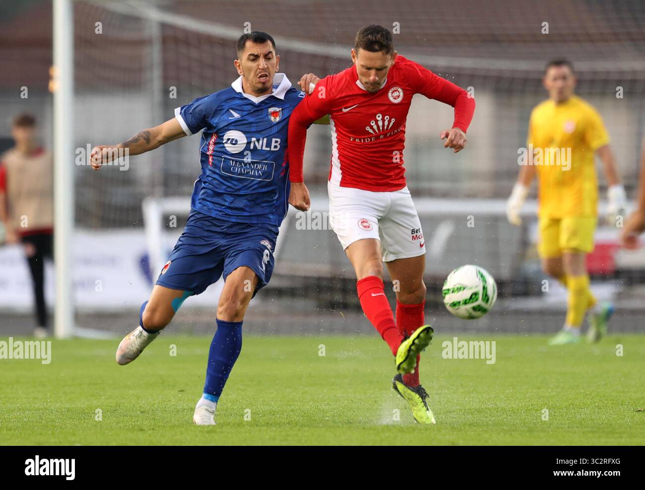 Prishtina's Leotrim Kryeziu (left) and Larne's Mark Randall battle for the ball during the UEFA ...