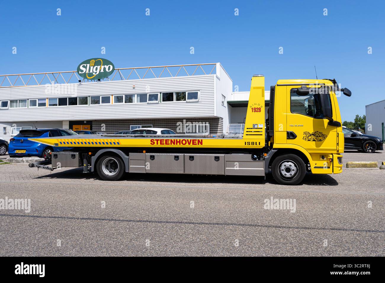 Steenhoven MAN TGL flatbed recovery vehicle Stock Photo - Alamy