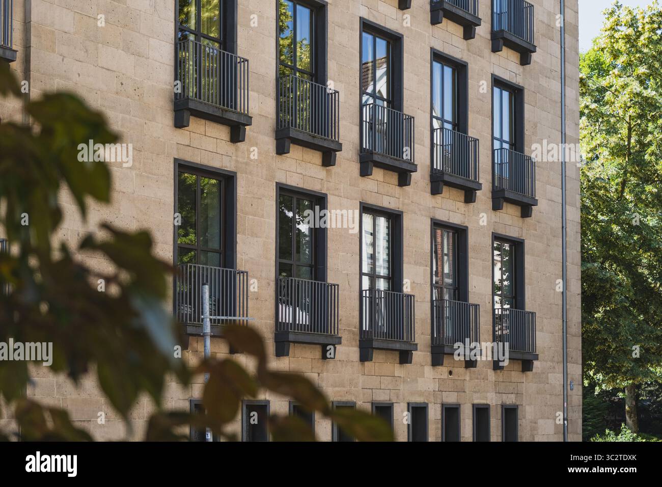 Modern building facade with small balconies and large windows Stock ...