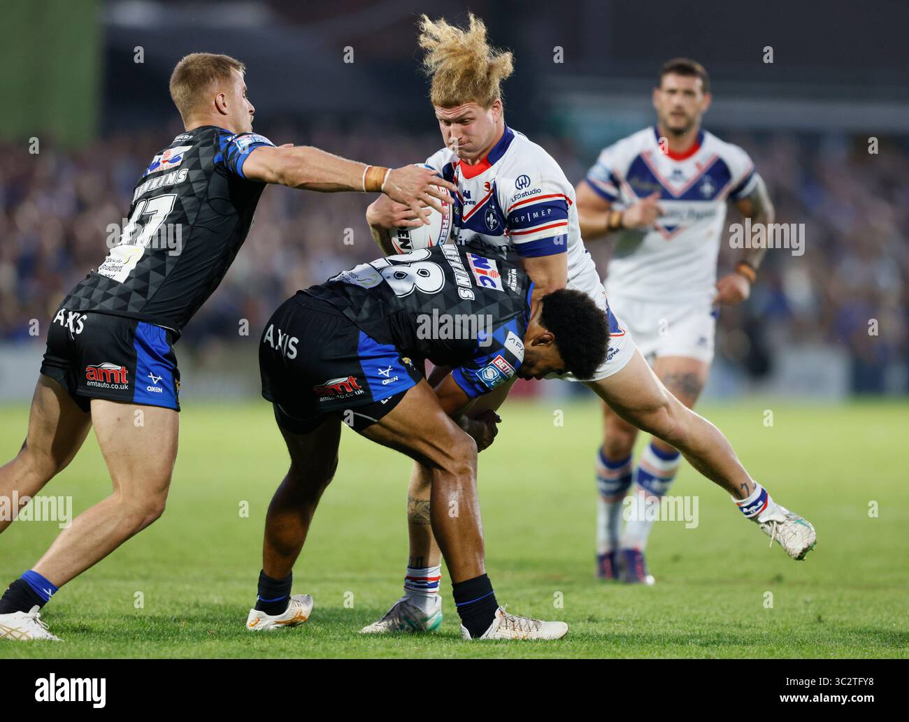 Wakefield Trinity's Caius Faatili (right) battles with Leeds Rhinos ...