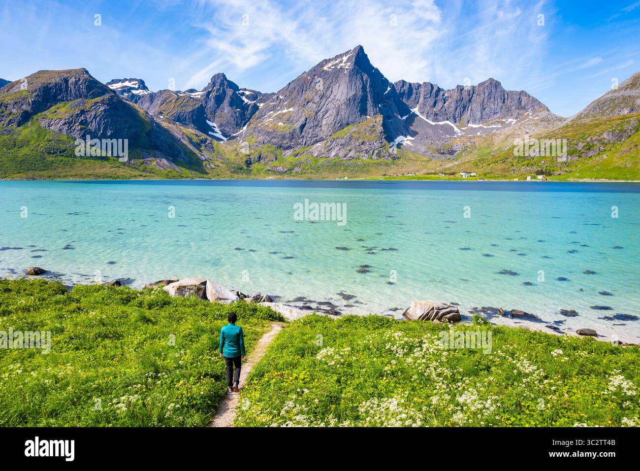 Female tourist on beautiful Morpheus beach and view of green meadow ...