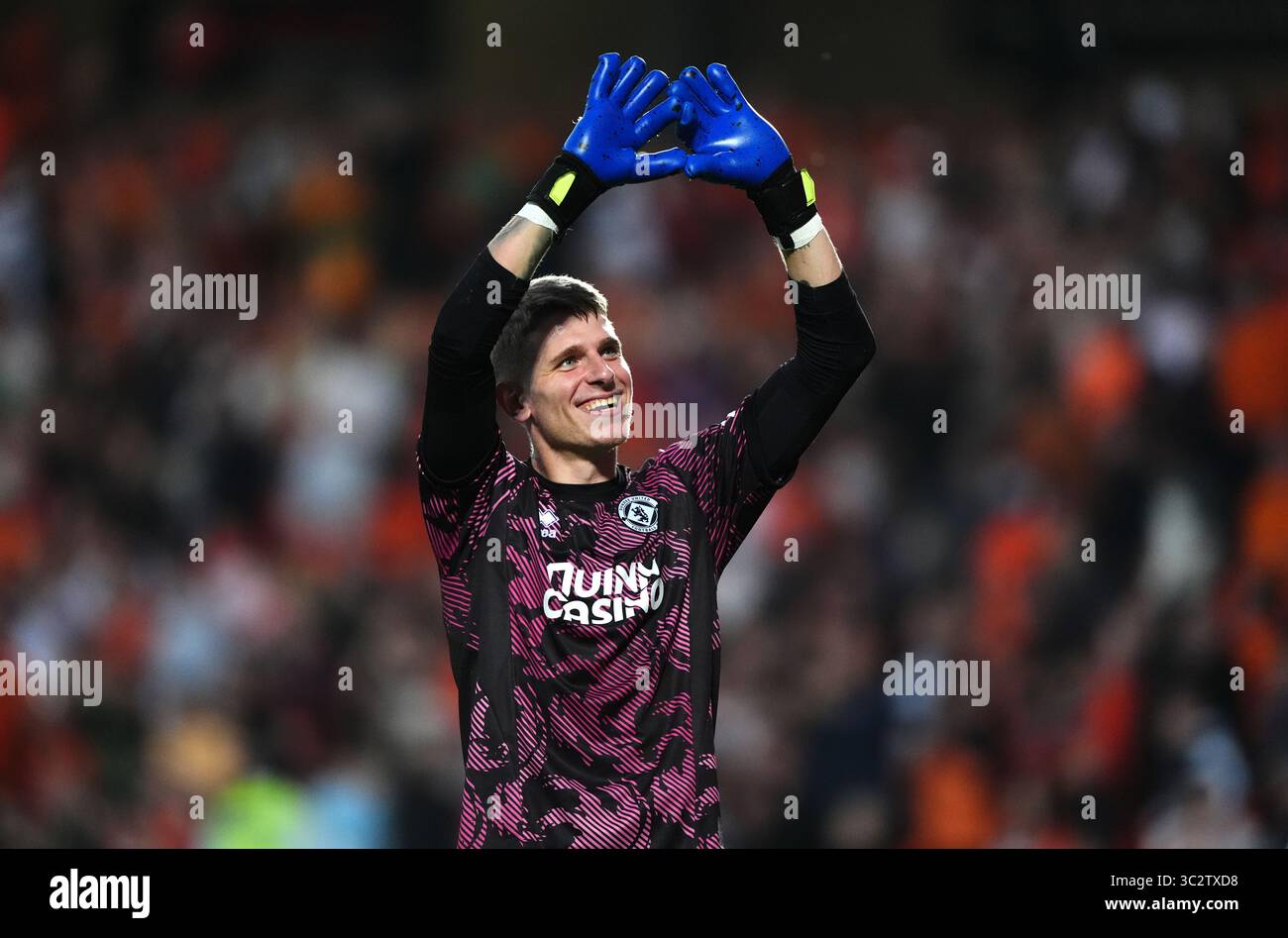 Dundee United goalkeeper Yevhenii Kucherenko salutes the fans following ...