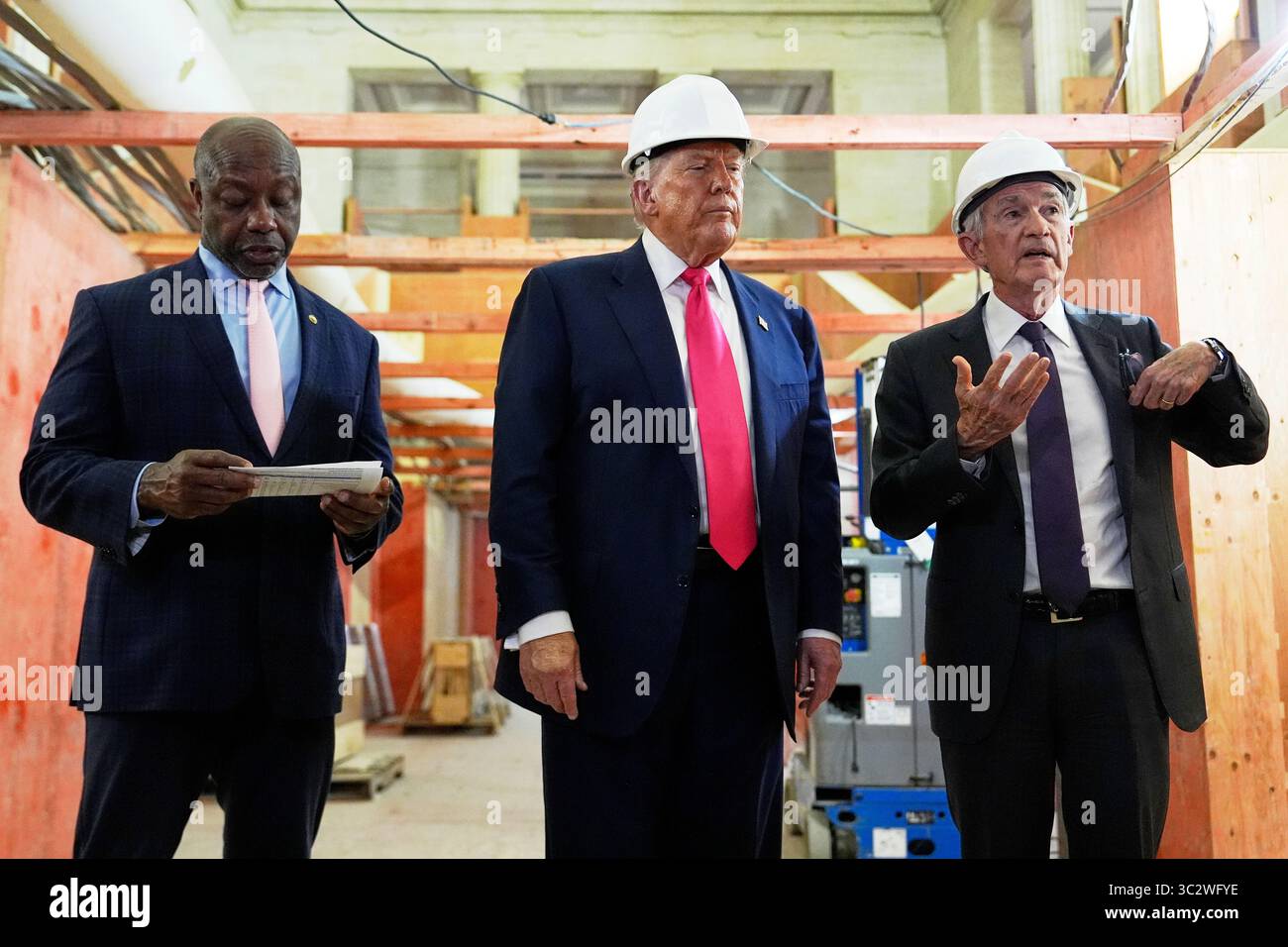 Federal Reserve Chairman Jerome Powell, from right, speaks as President ...